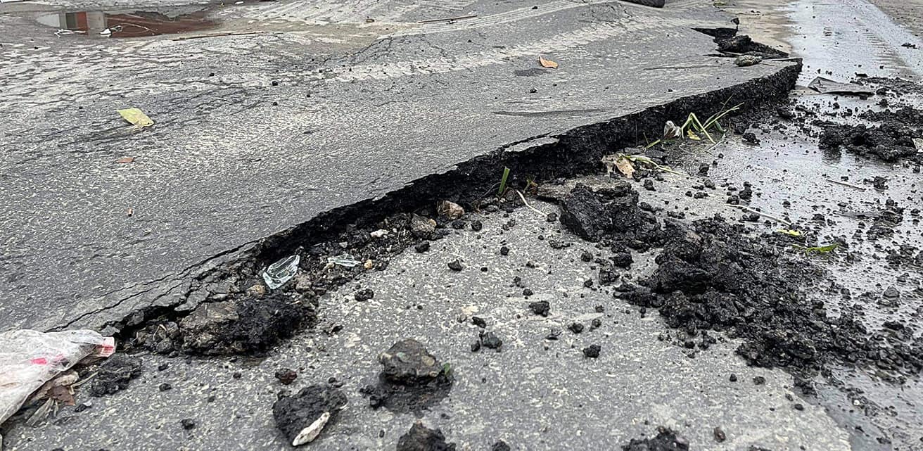In Photos: Floodwater damages Mandaue City road | Cebu Daily News
