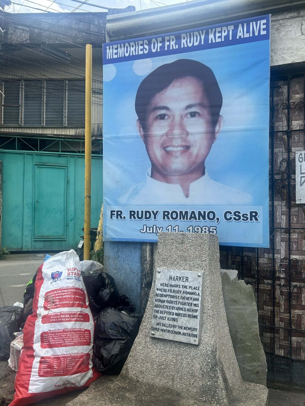 SILOY IS WATCHING: Fr. Rudy Romano marker surrounded by garbage