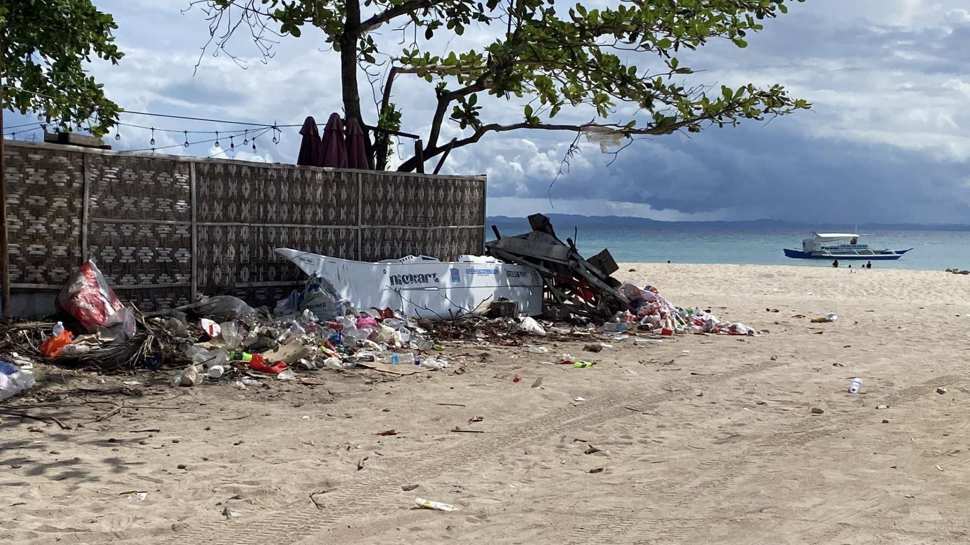 Santa Fe beach in Bantayan Island spoiled with New Year trash